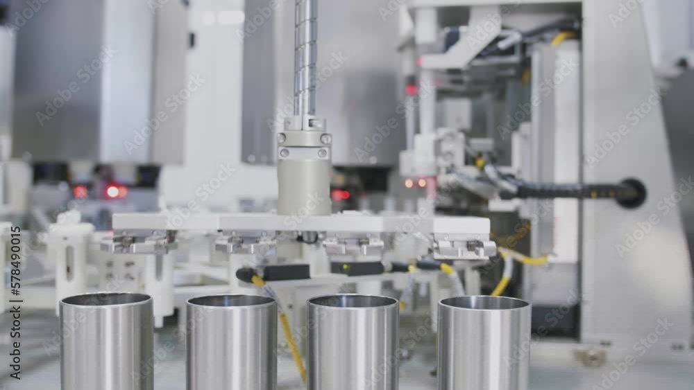 Automated Robotic equipment at factory. Commercial mass production ...