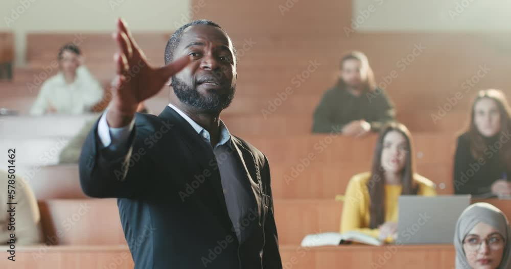 African American male professor standing in front of students and ...