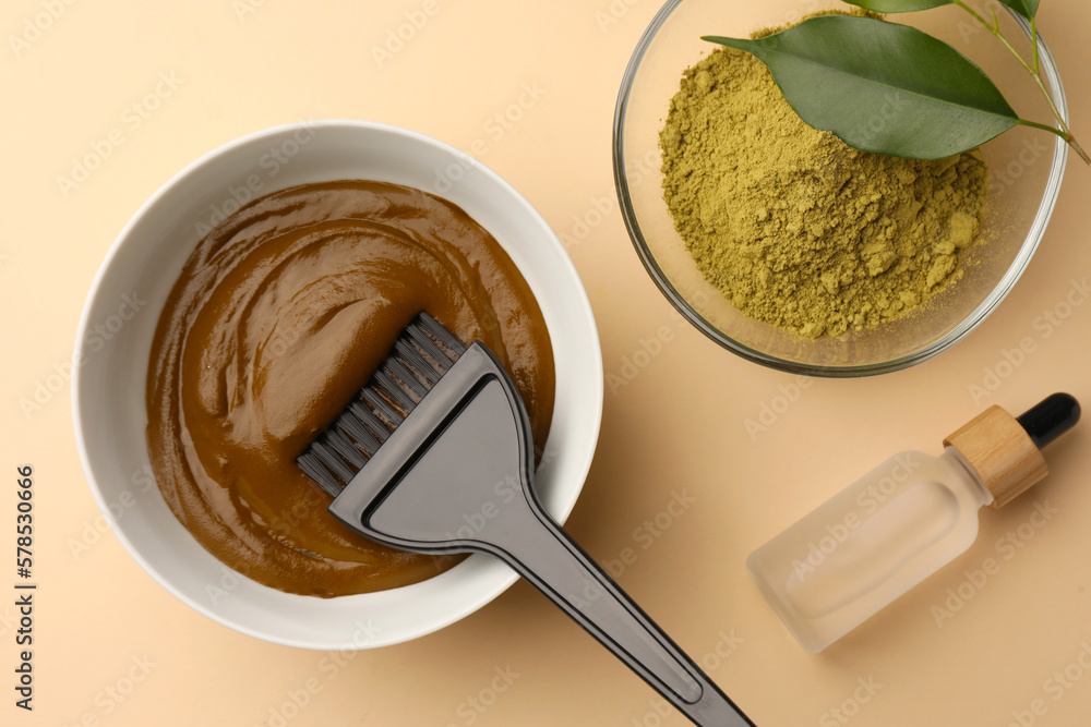 Henna powder and cream, bottle of liquid on beige background, flat lay ...