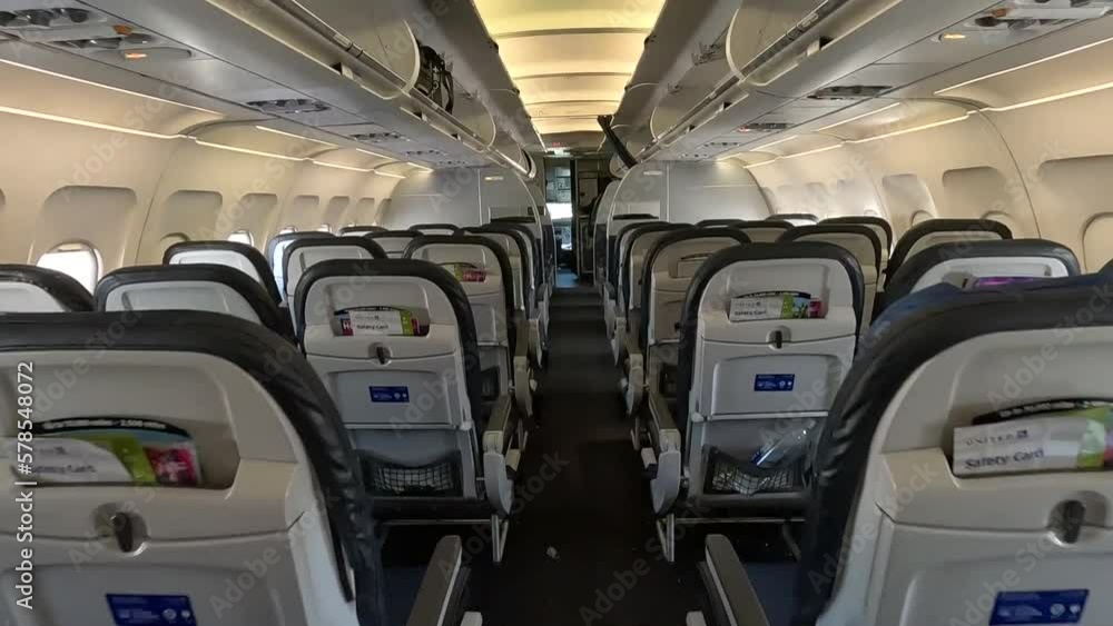 Down the isle inside of Commercial Airplane in Stock Video | Adobe Stock