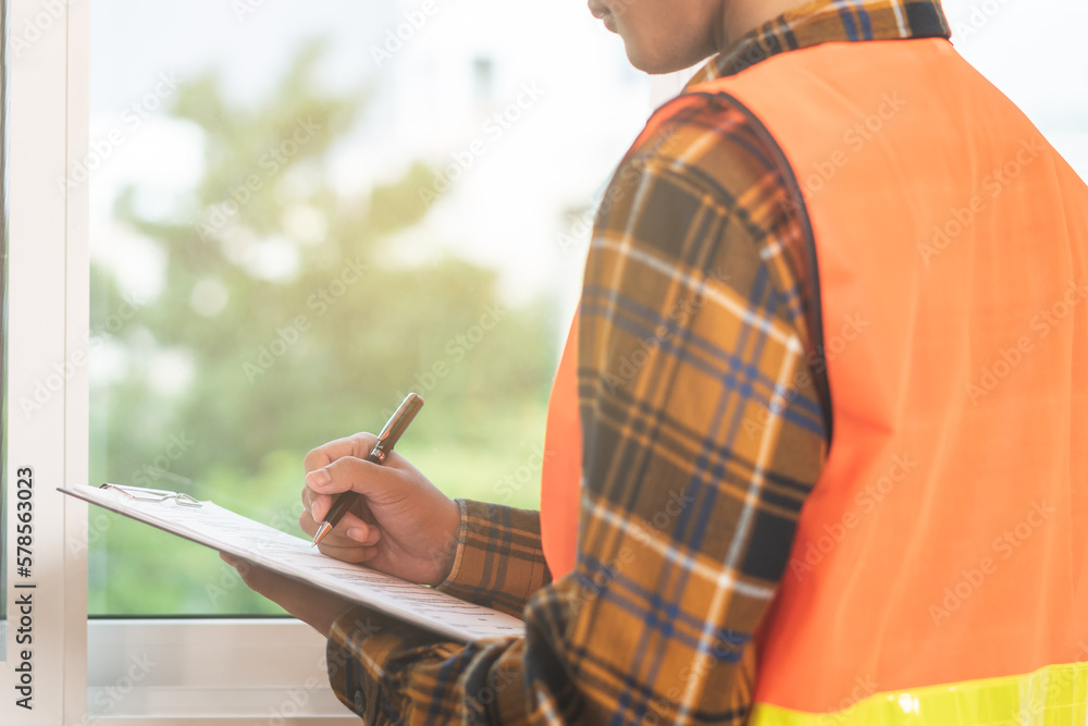 Building inspection, asian contractor young man, male inspecting home ...
