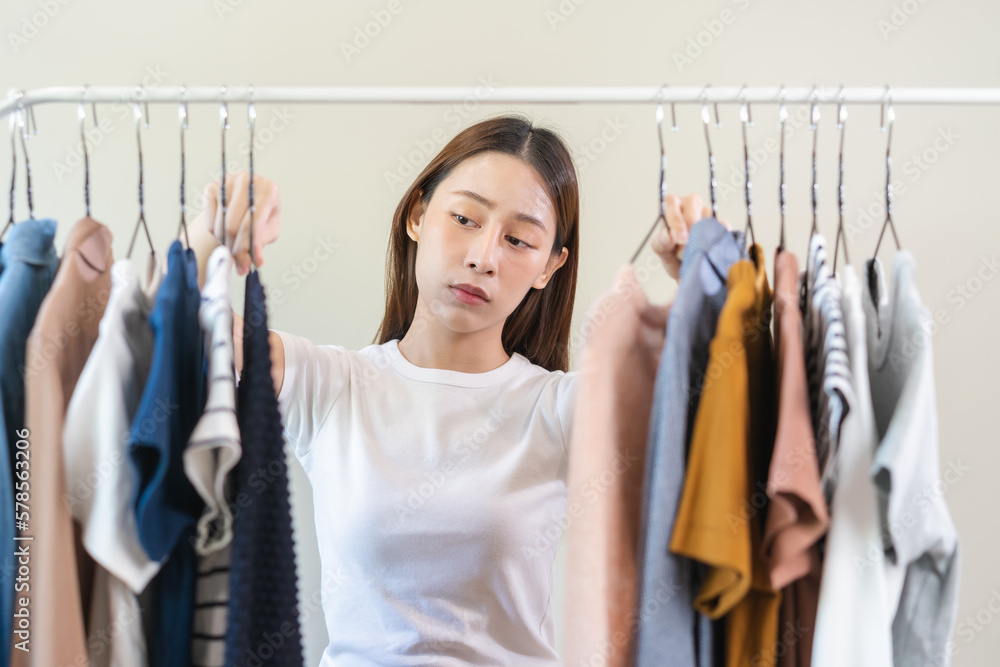 Choice of clothes,Nothing to wear. Attractive asian young woman, girl ...