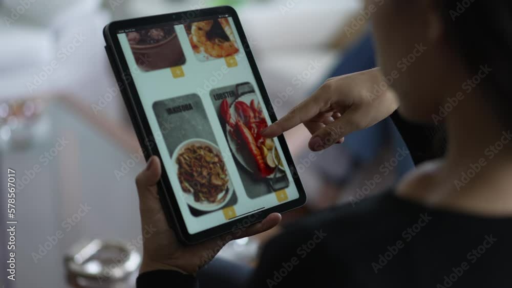 Person scrolling through food menu at online app delivery order. Over ...