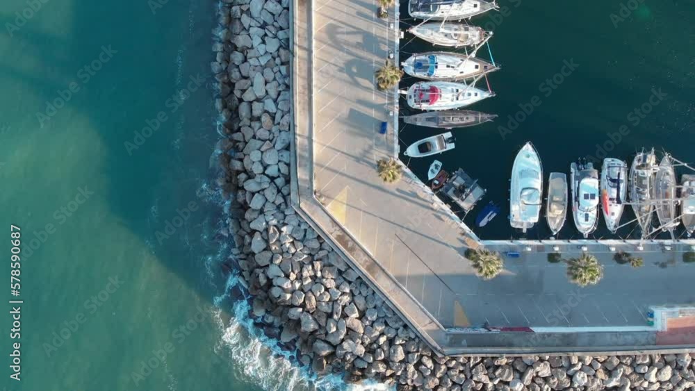 Drone flyover view of port road with yachts and pier , Aerial top-down ...