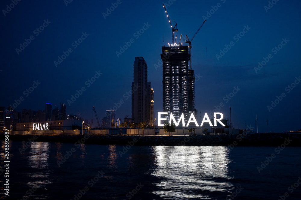 skyline at night logo EMAAR building Dubai city Stock Photo | Adobe Stock