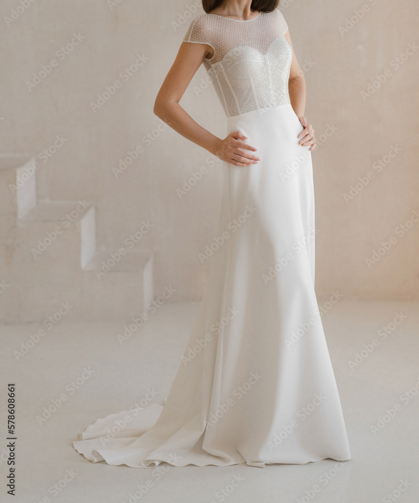 Classic white long wedding dress with beaded top and short sleeves ...
