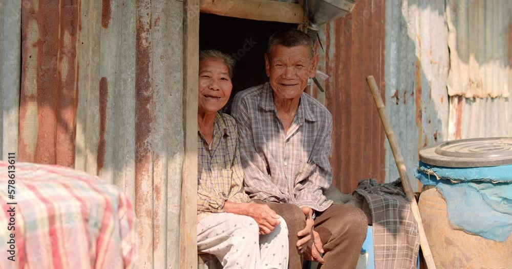 Happy smiling Asian woman and her husband who are poor elderly native ...