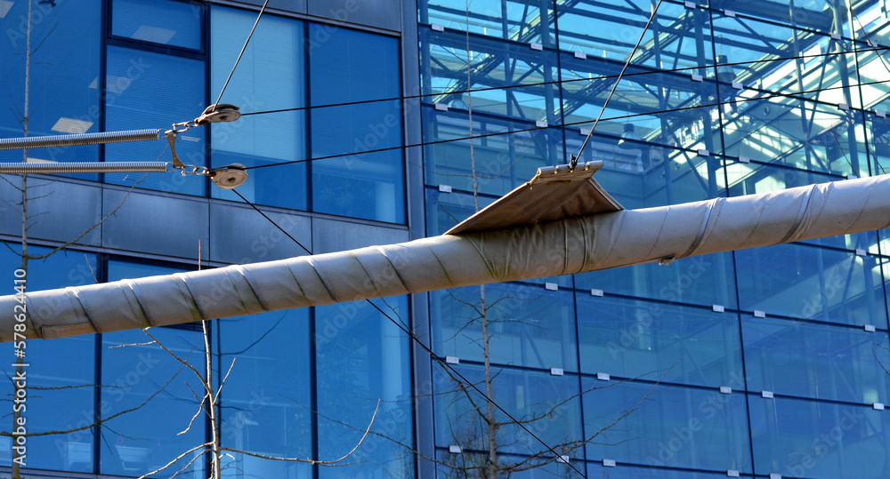 parasol, awning, folding tarpaulin against the sun is rolled up into a ...