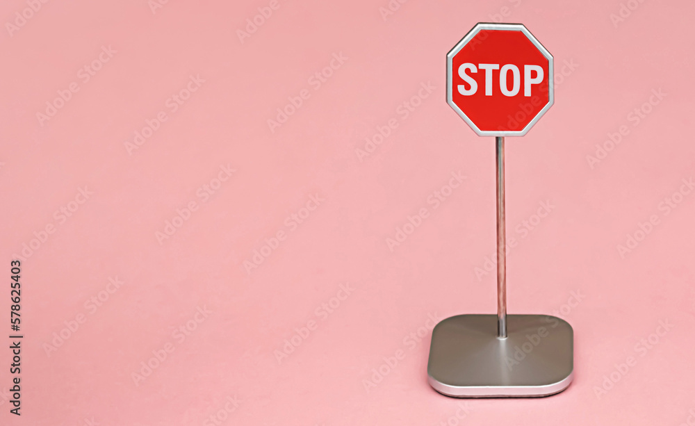Red stop sign, traffic warning octagon pink background with copy space ...