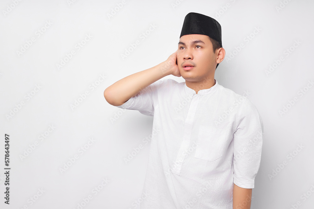 Portrait young Asian Muslim man wearing Arabic clothes standing while ...