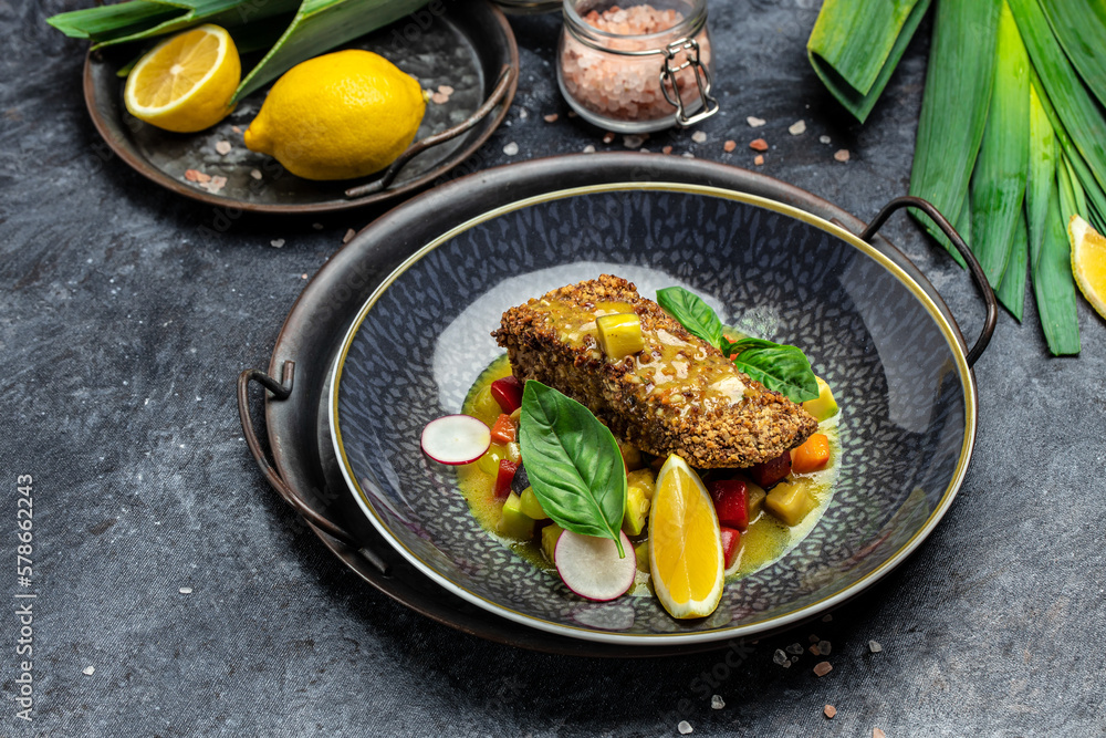 fish fillet breaded in nuts with pepper sauce and vegetables, Healthy ...