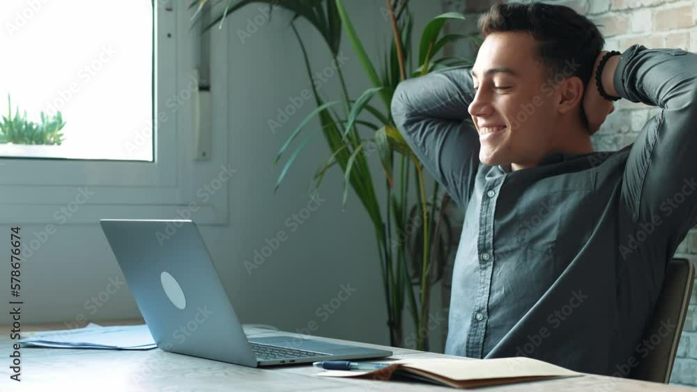 Calm millennial man in glasses sit relax at home office workplace take ...