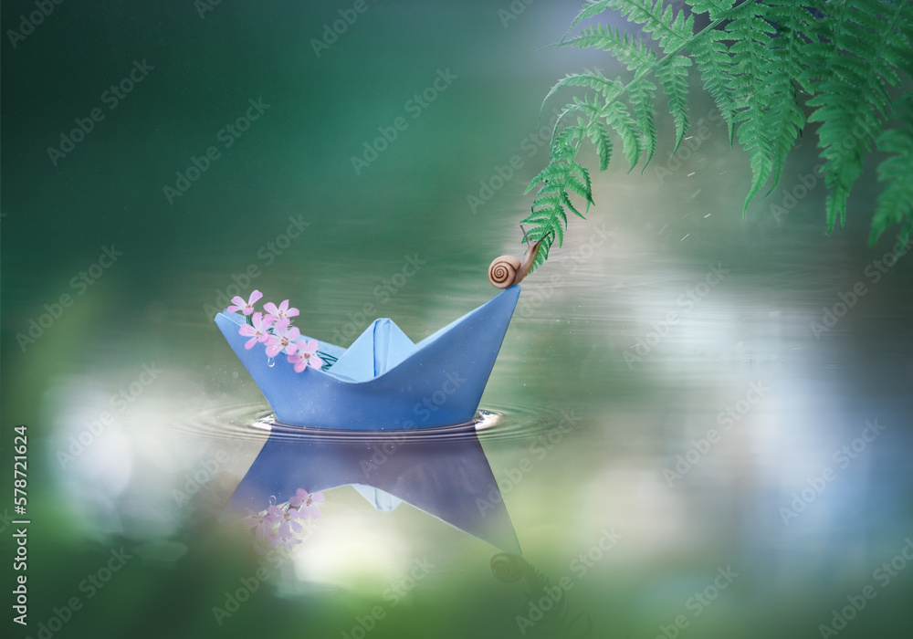 Paper boat on the background of beautiful nature. A fairy tale plot of ...