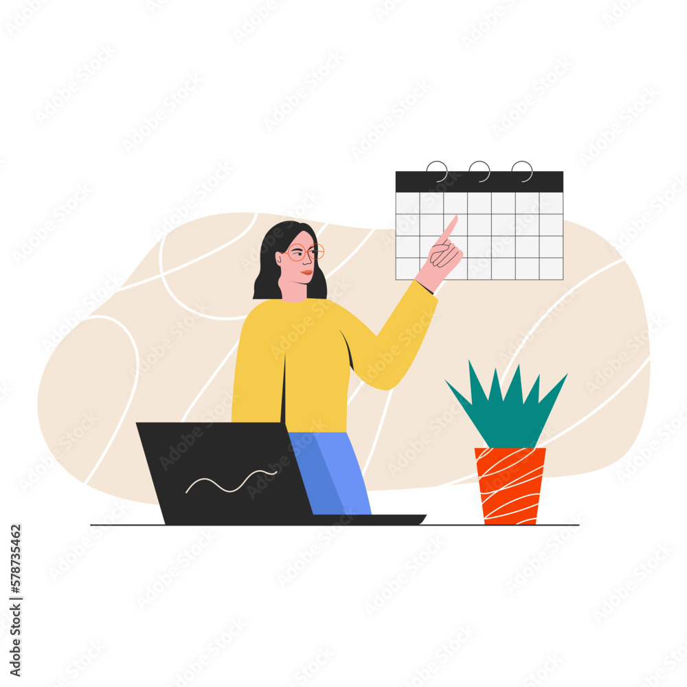 Woman pointing at calendar with laptop on the table. Management concept ...