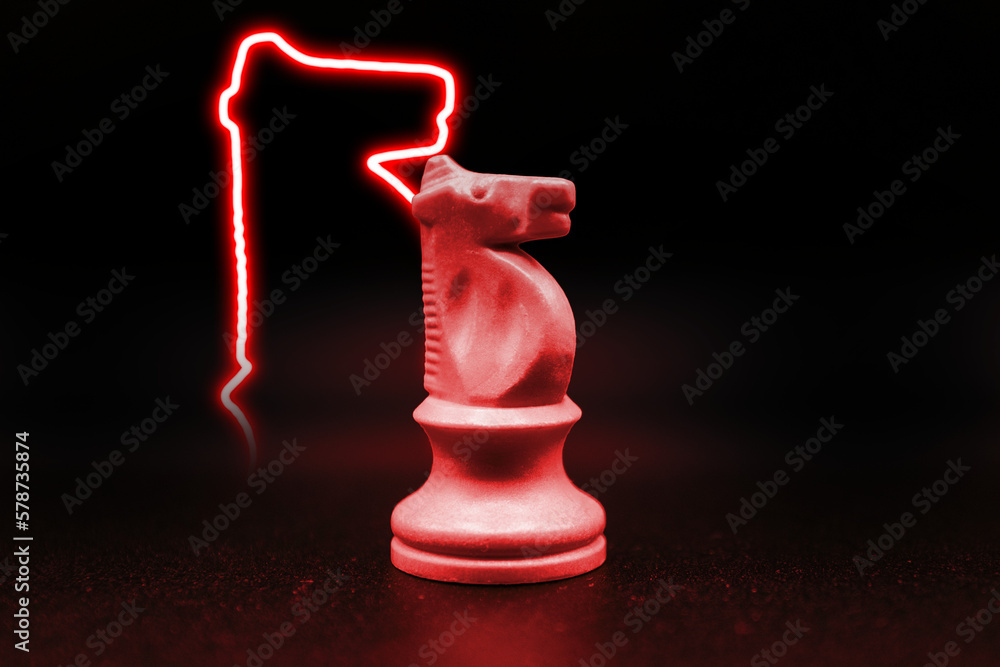 red chess knight with led in the shape of a knight. close up photo with ...