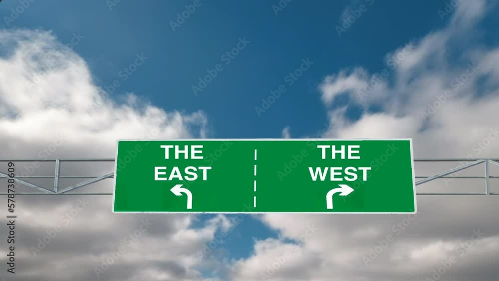 Zoom to an overhead road signs pointing the way in opposite directions ...