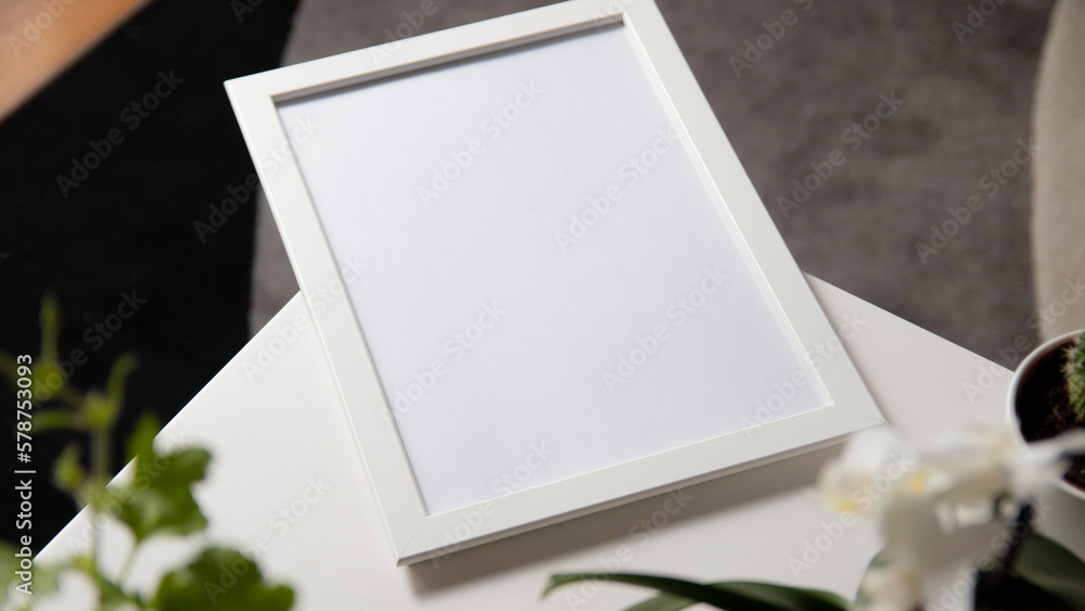 Blank photo frame to place text or image, on white wooden background ...