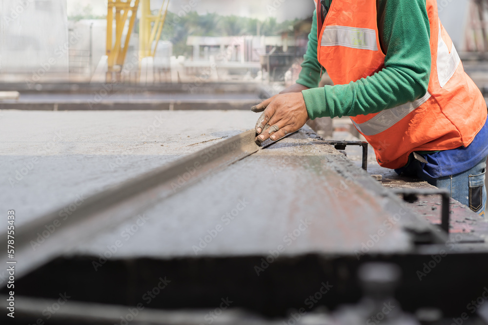 Construction technician working by leveling concrete floor to smooth ...