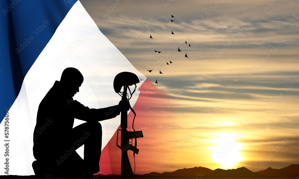 Silhouette of French soldier kneeling down against the sunset and ...