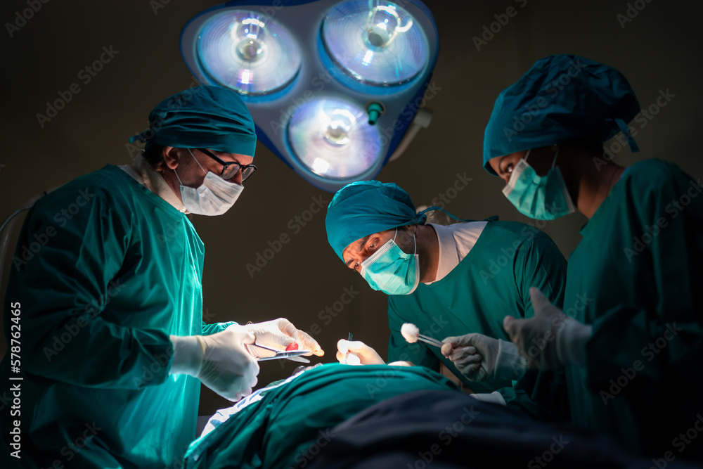 Professional Medical Doctors and team performing surgical operation in ...