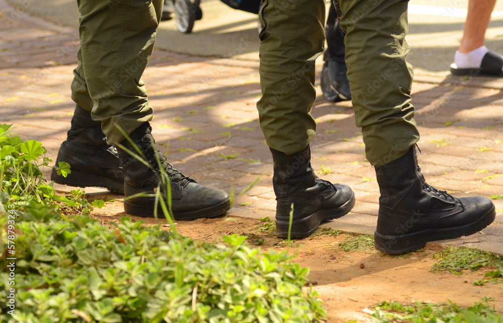 Soldier's boots on the feet of an Israeli soldier. Concept: Soldiers ...