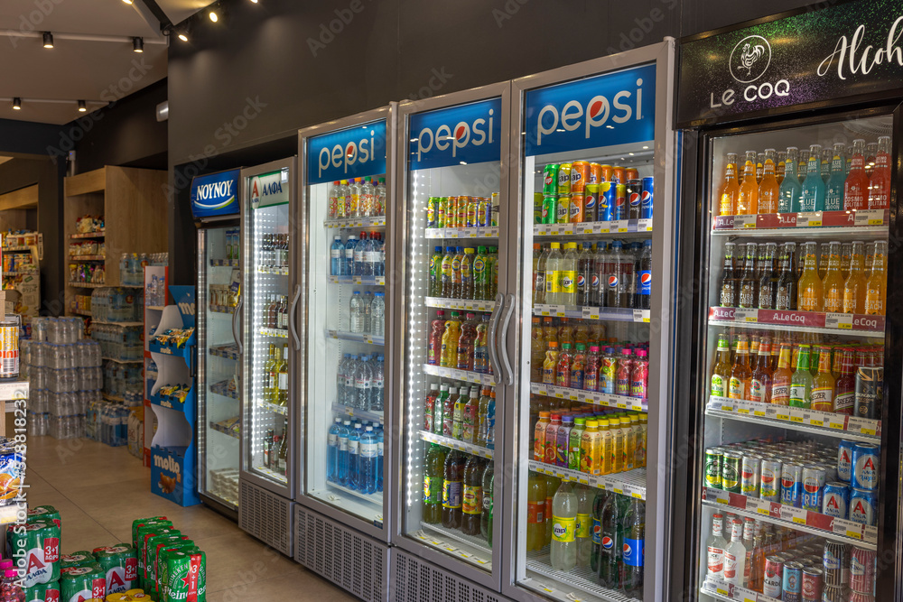 Interior view of store with soft drinks and beer in cooling chambers ...