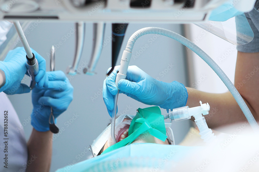 The child treats teeth under general anesthesia. Treatment of baby ...