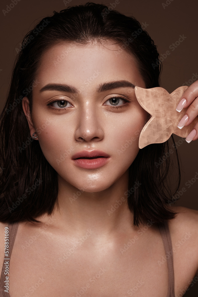 Beautiful Young Girl With Natural Nude Make Up With Gua Sha For Facial 2644