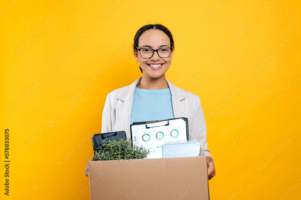 Newcomer girl got new job. Positive mixed race young woman with glasses ...