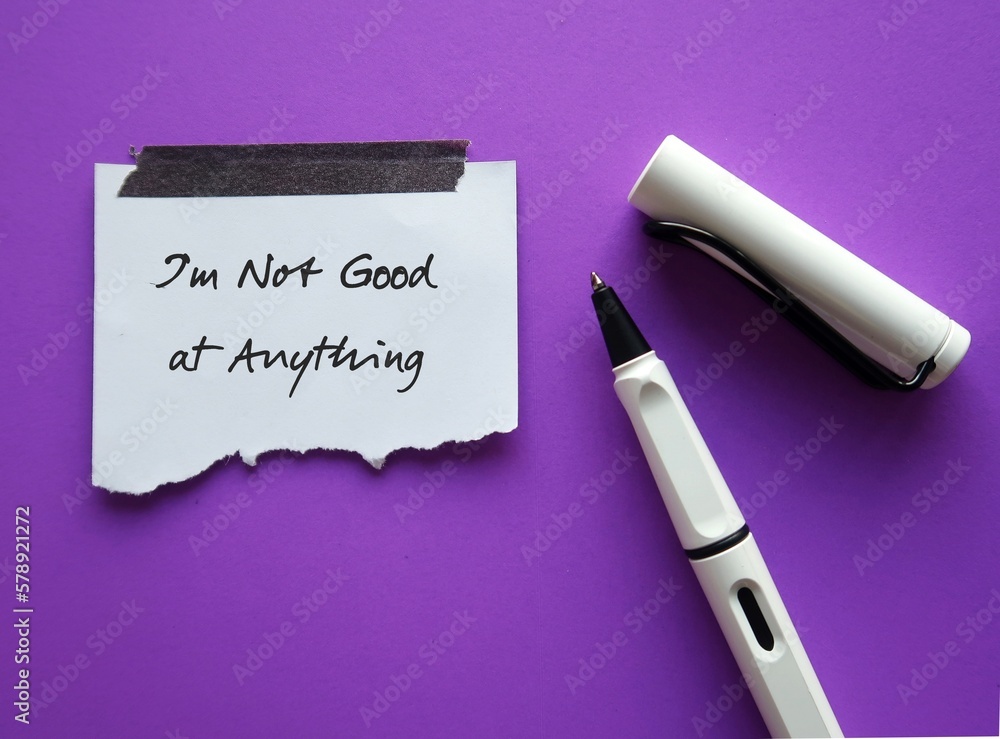 Pen and stick note on purple background with handwritten text - I’m Not ...