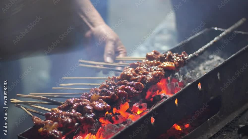 Sheep or goat satay on traditional charcoal fire. satay on fire with ...
