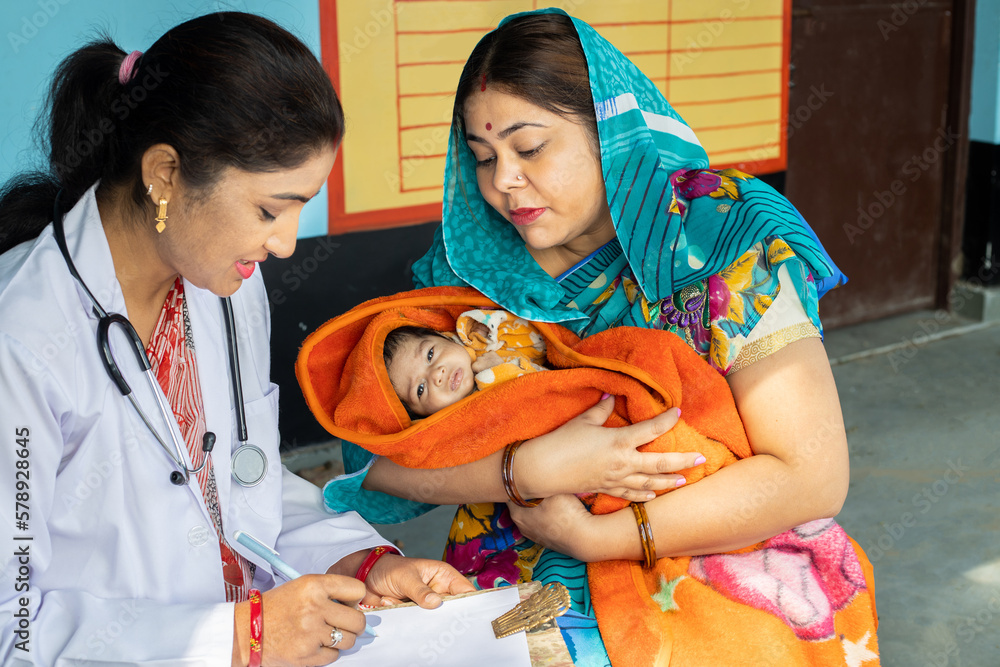 Indian pediatrician doctor examine new born baby at village, Mother ...