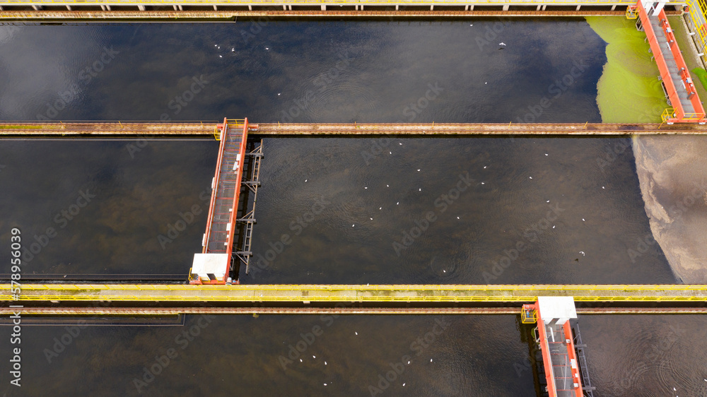 Aerial closeup of rectangular tanks of a sewage and water treatment ...