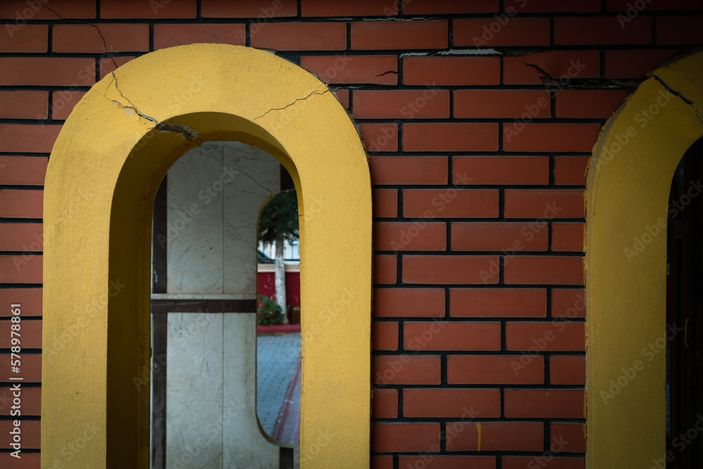 Wall of the apartment entrance damaged in the earthquake. Earthquake ...