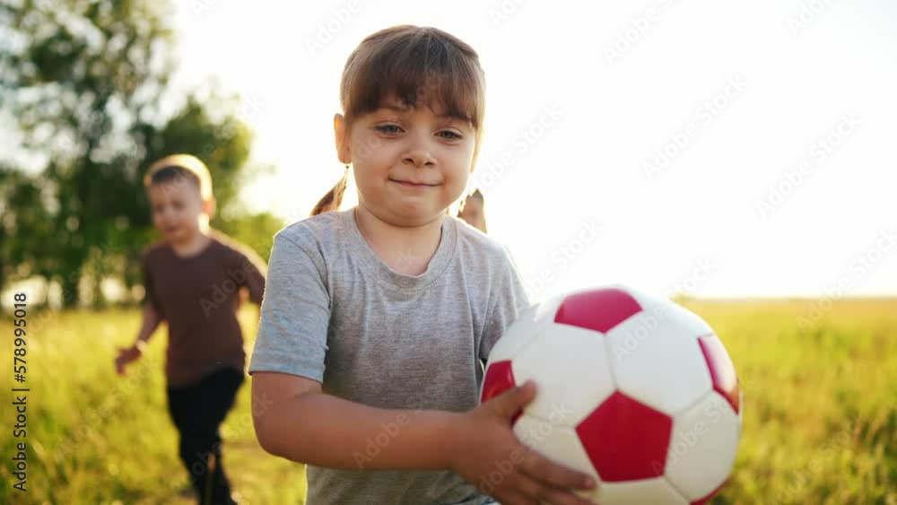 children in the park. play ball, run and team up. happy family kid ...
