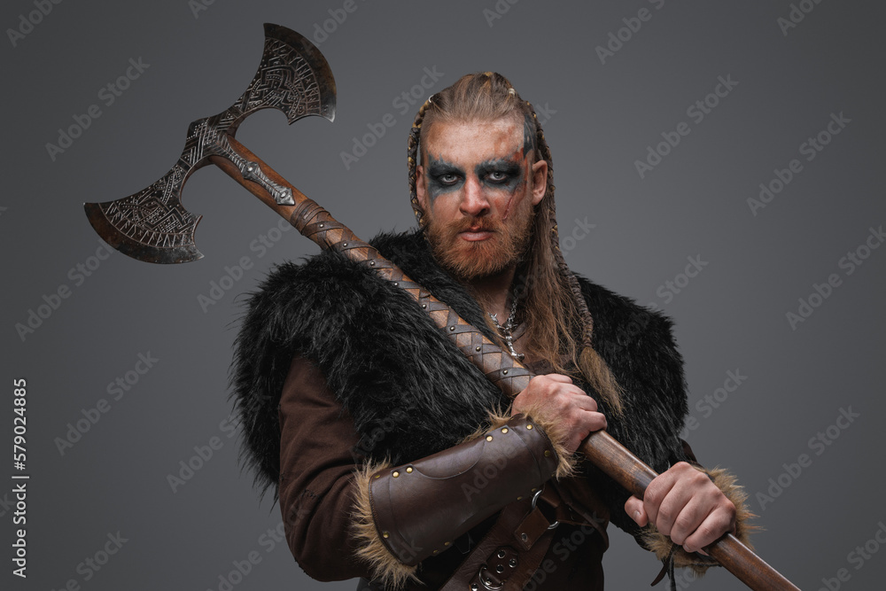 Portrait of antique barbaric warrior from nord dressed in leather armor ...