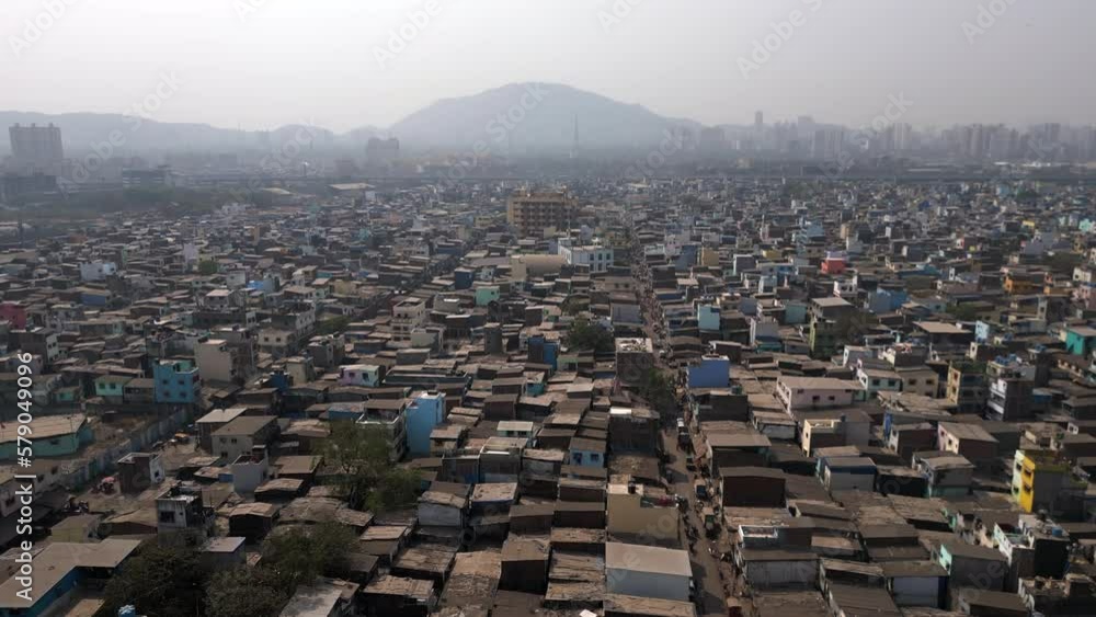 Aerial jib shot showing residential buildings in the crowded Govandi ...