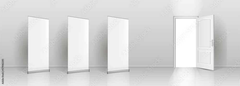 The interior of an empty room with a white banner and an open door ...