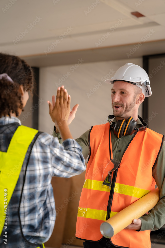 Architect team and Colleagues mixed race, join hands to join forces to ...