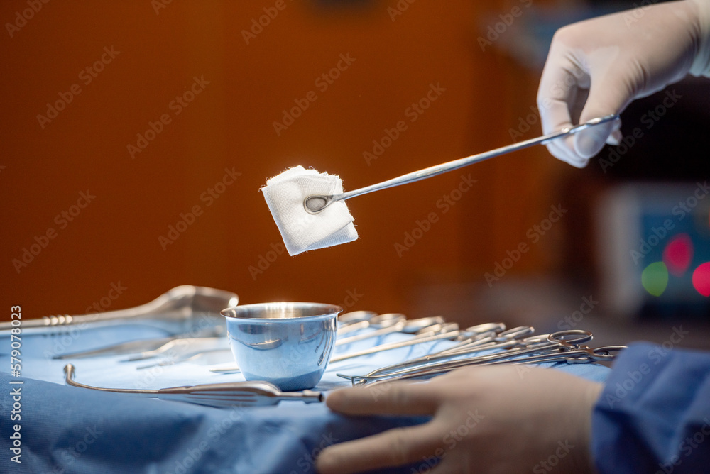 Hand of surgery doctor in Operating Room hold operating plier forceps ...
