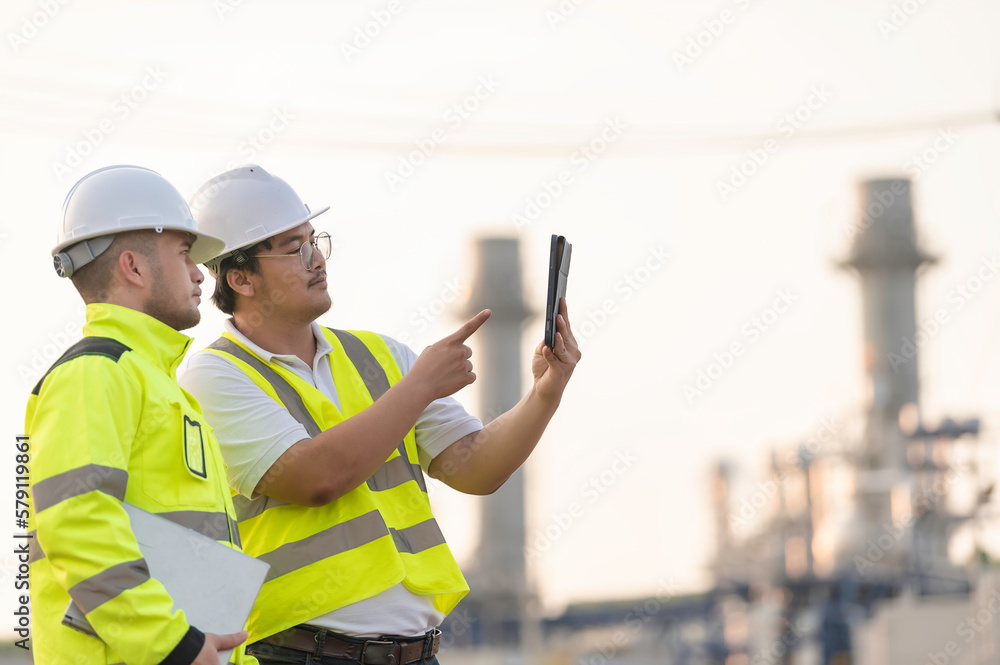 Group Asian man petrochemical engineer working at oil and gas refinery ...