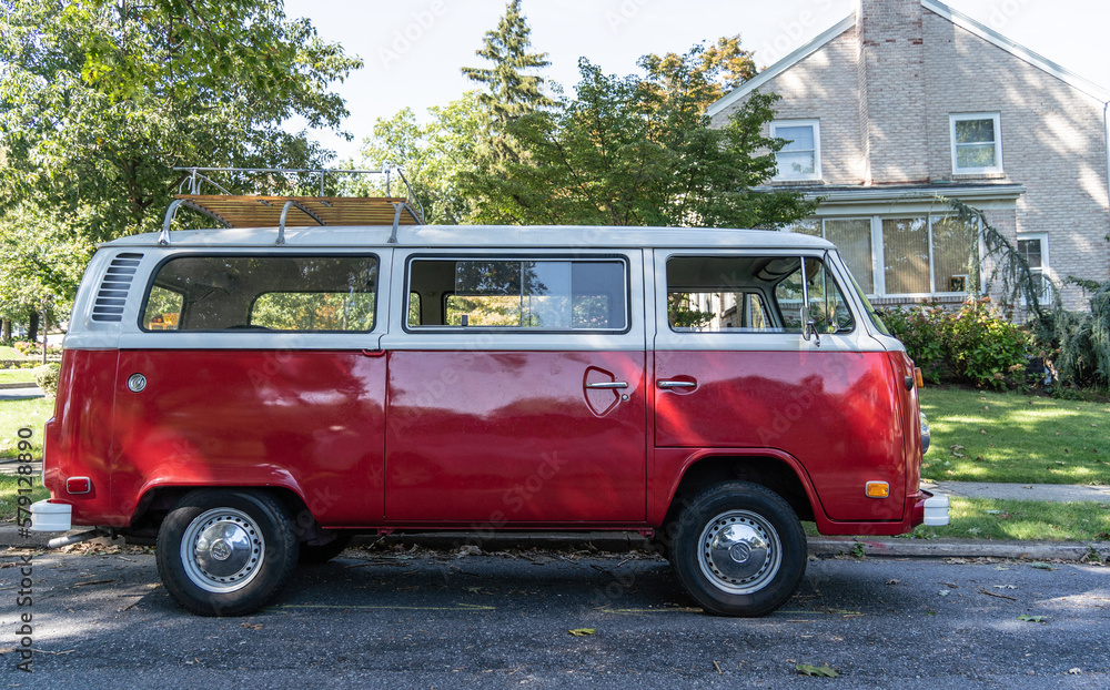 Red Volkswagen Van side-view parked on suburban street. Stock Photo ...