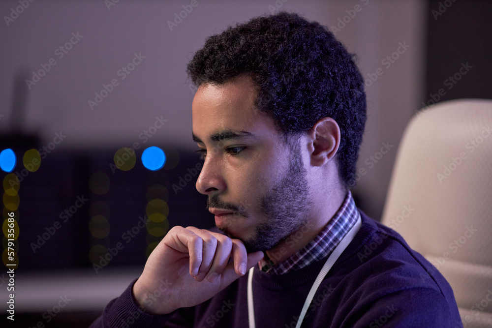 Side view portrait of focused man thinking while working on IT project ...