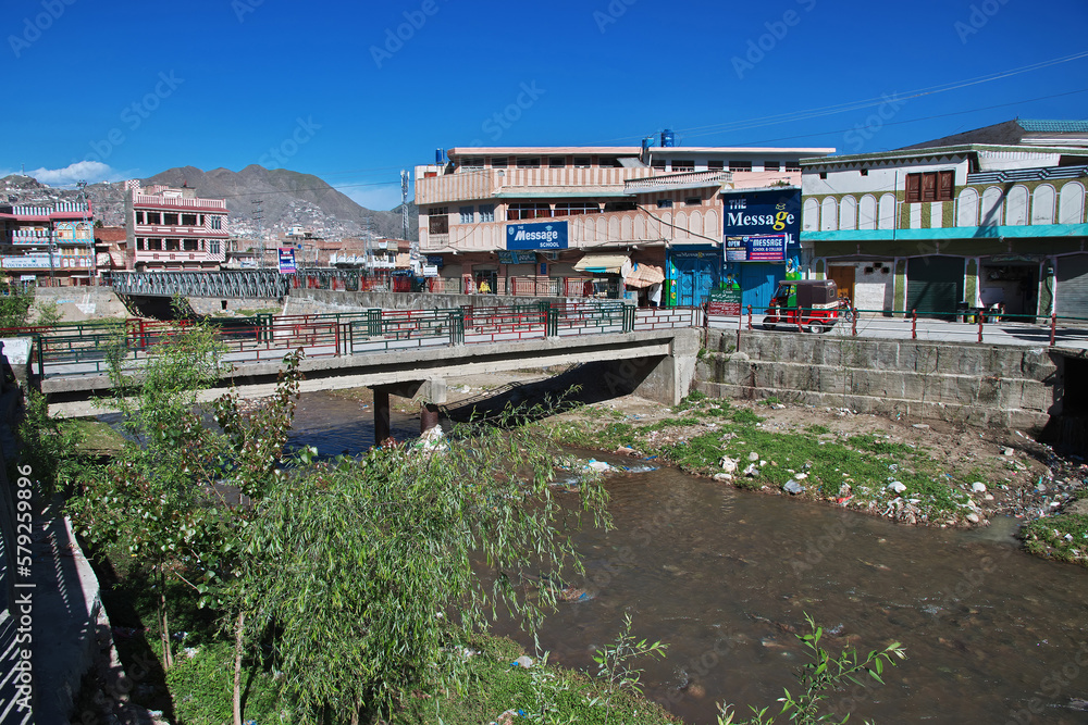Mingora, Pakistan - 01 Apr 2021: A small river in Mingora, Swat valley ...