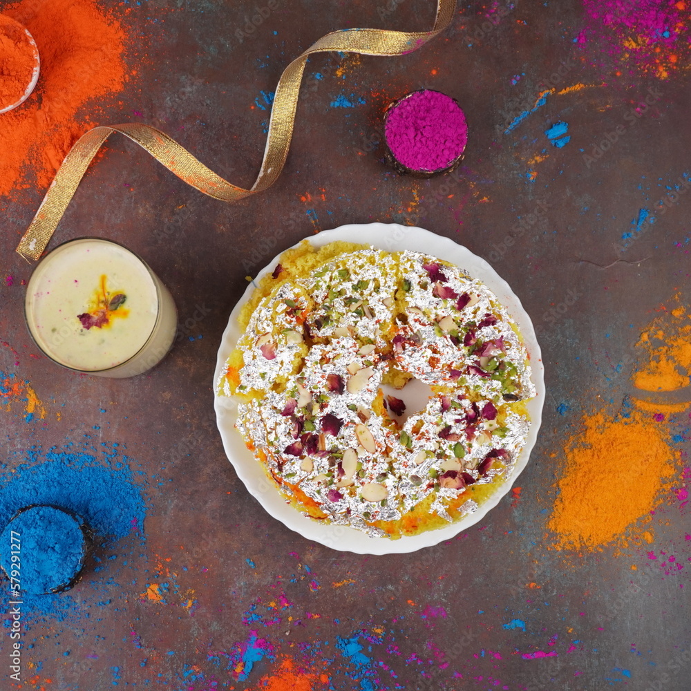 Ghewar is a disc-shaped sweet with a texture that resembles a honeycomb ...