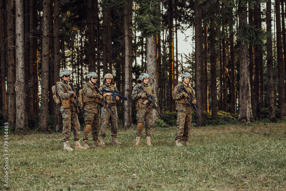 Soldier fighters standing together with guns. Group portrait of US army ...