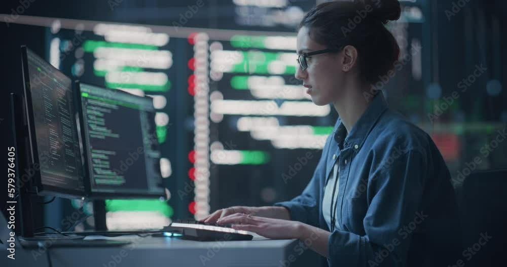 Medium Shot of a Woman Working as a Developer, Surrounded by Big ...
