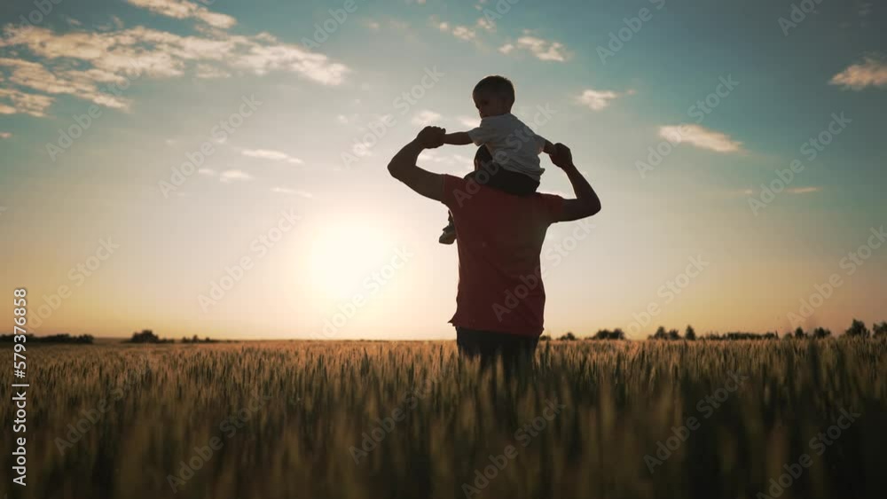Happy family. Father Day.Baby sits on father neck.Boy on his father ...