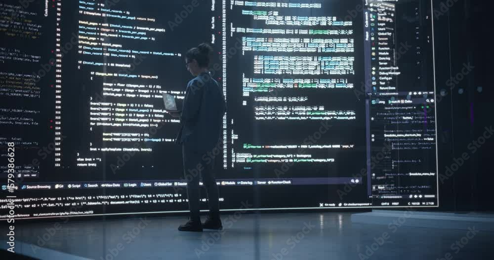 Back View Shot of Female Programmer Working in a Monitoring Control ...