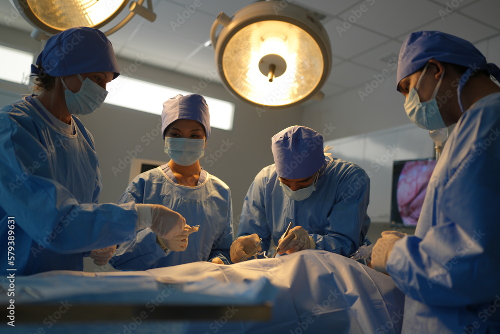 Medical Team Performing Surgical Operation in Modern Operating Room ...